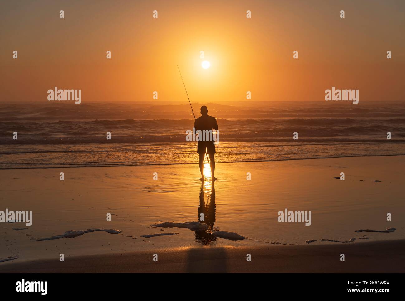 Solo fisherman in silhouette rod hi-res stock photography and images ...