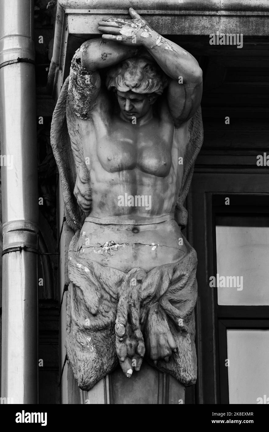 Russia St. Petersburg 07.07.2022 Statue of Atlant supporting the vault ...