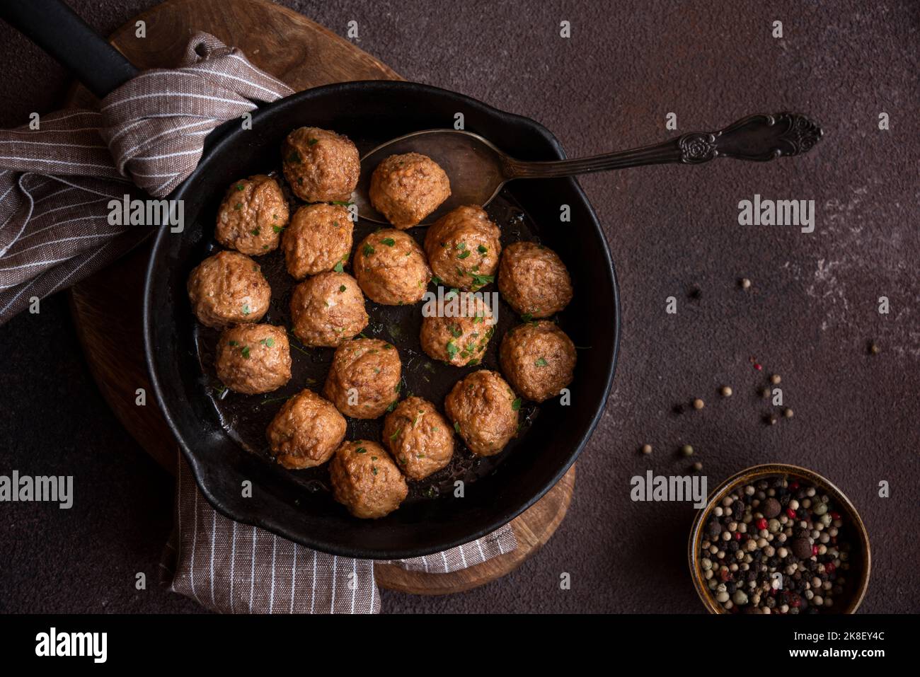 Meatballs in a black frying pan on dark background Stock Photo - Alamy
