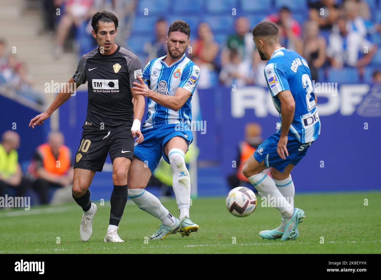 Pere Milla of Elche CF, Sergi Gomez and Oscar Gil of RCD Espanyol ...