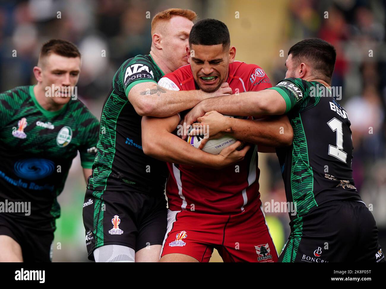 Lebanon's Charbel Tasipale (centre) is tackled by Ireland's Brendan O ...