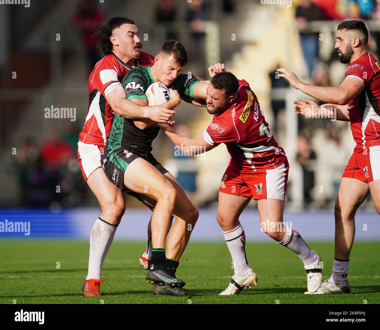 Ireland's Louis Senior (centre) is tackled by Lebanon's Khalil Rahme ...