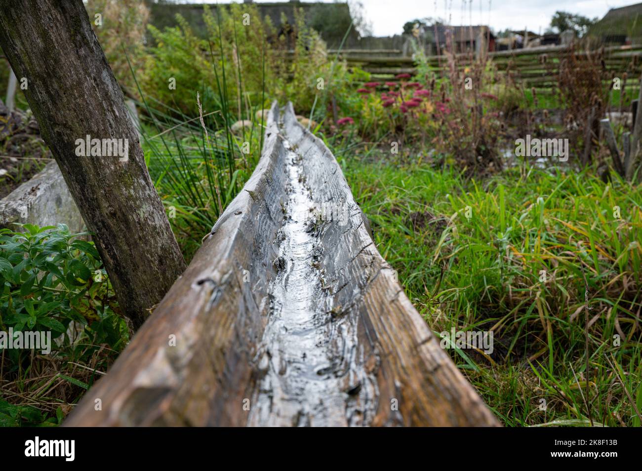 Distribution of water for fields and plants by using a carved wooden ...