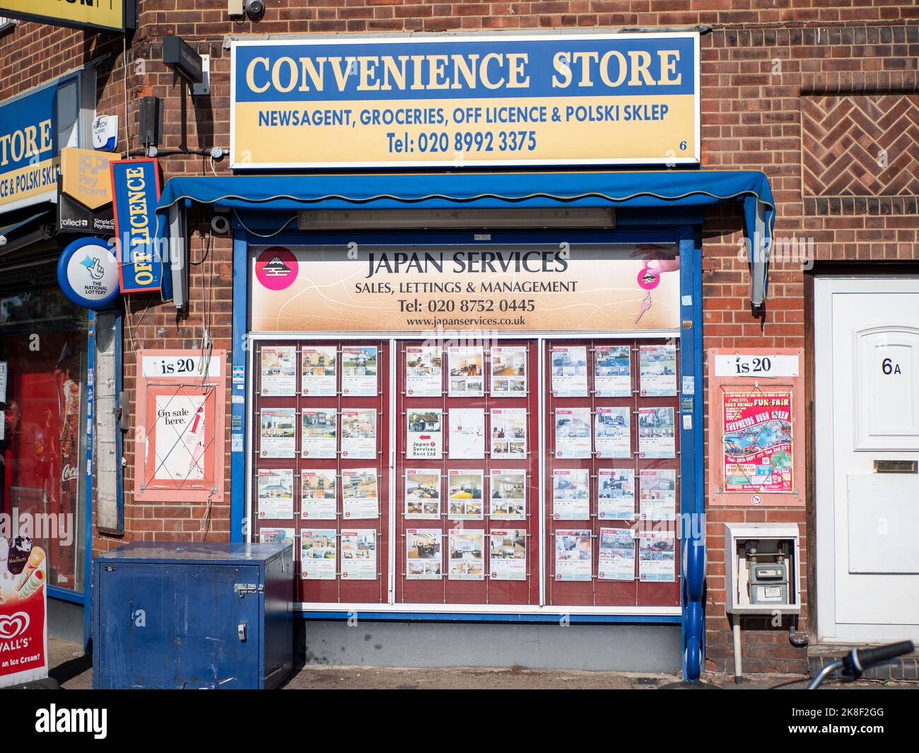 A view of a Japanese rental company's listings in a window of a ...