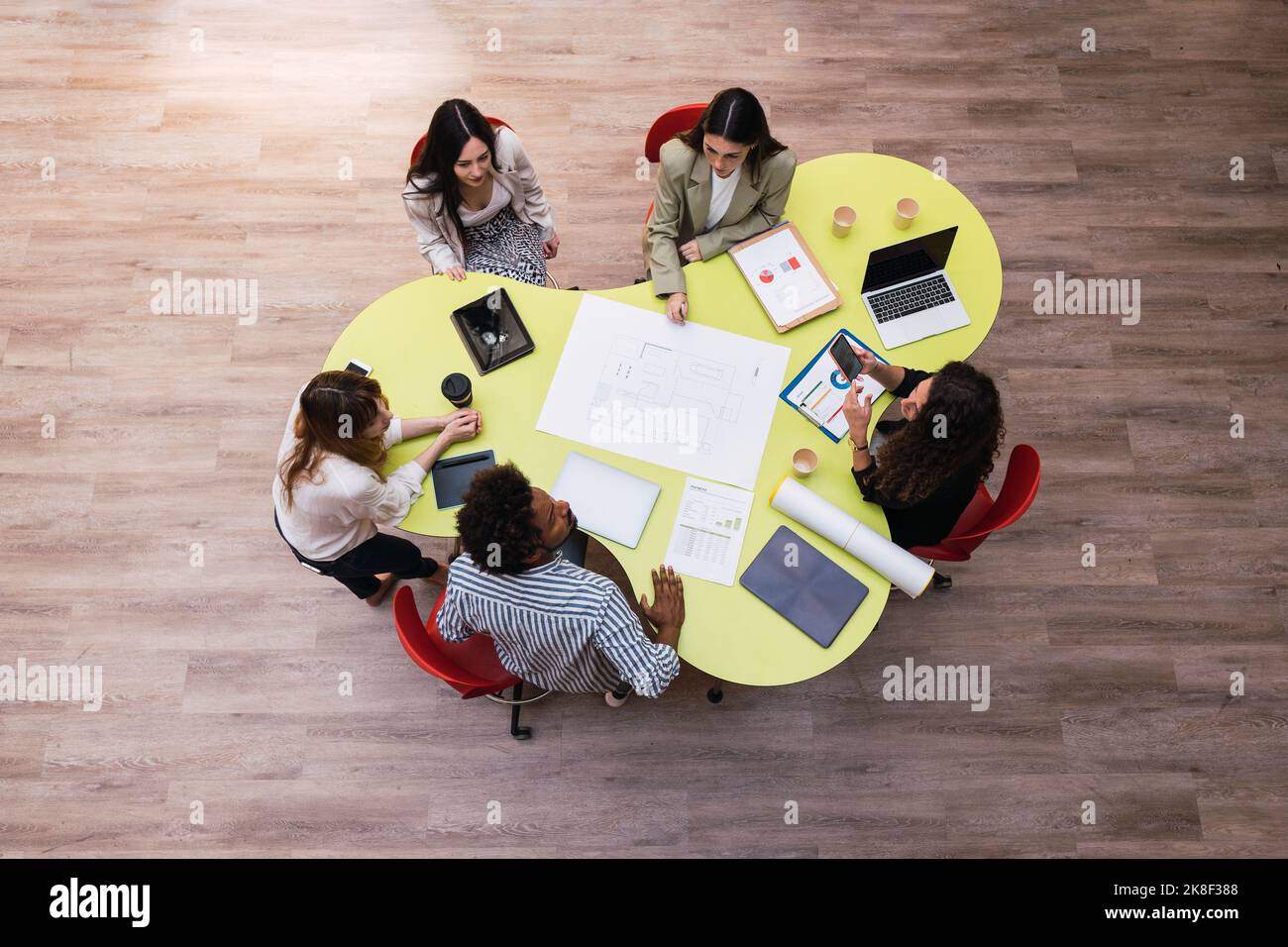 Business team having a meeting at table in conference room Stock Photo ...