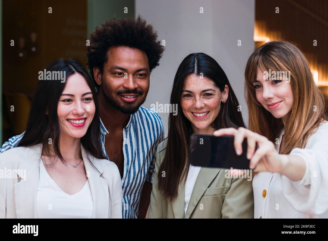 Smiling business team taking a selfie in office Stock Photo - Alamy