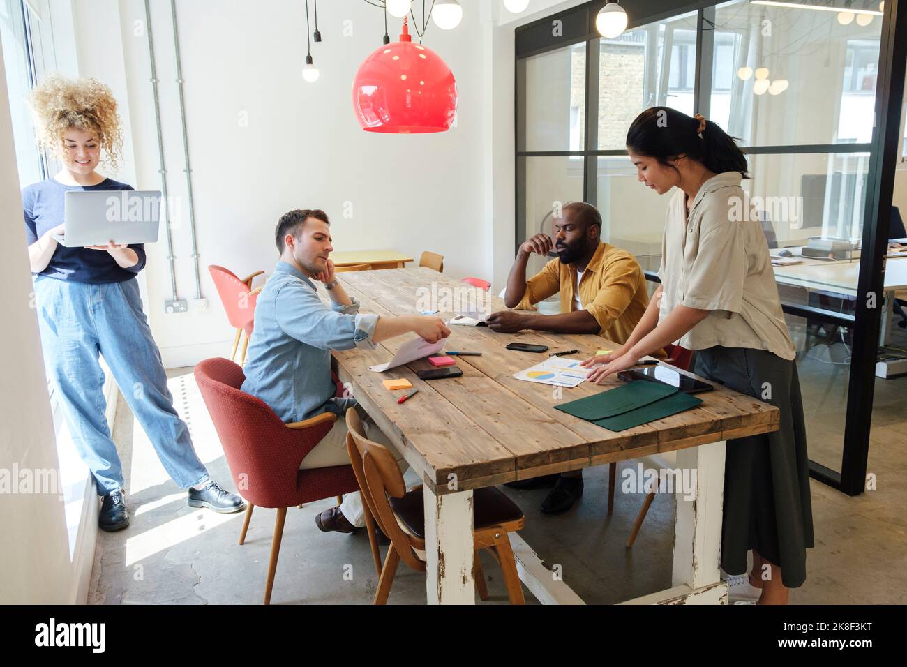 Business people working together in modern coworking space Stock Photo ...