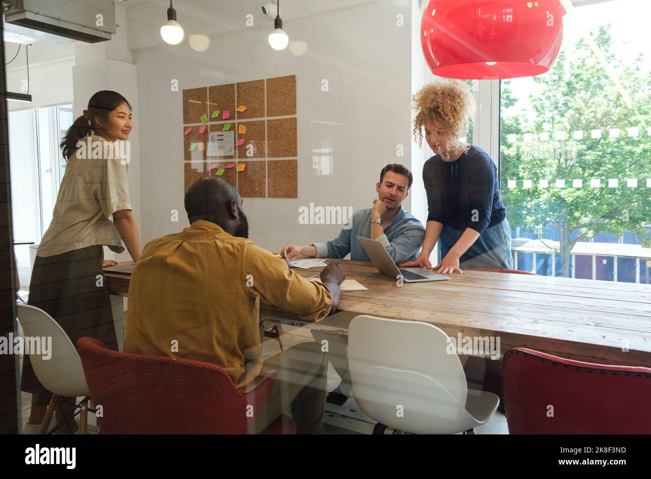 Creative business people having meeting in modern conference room ...