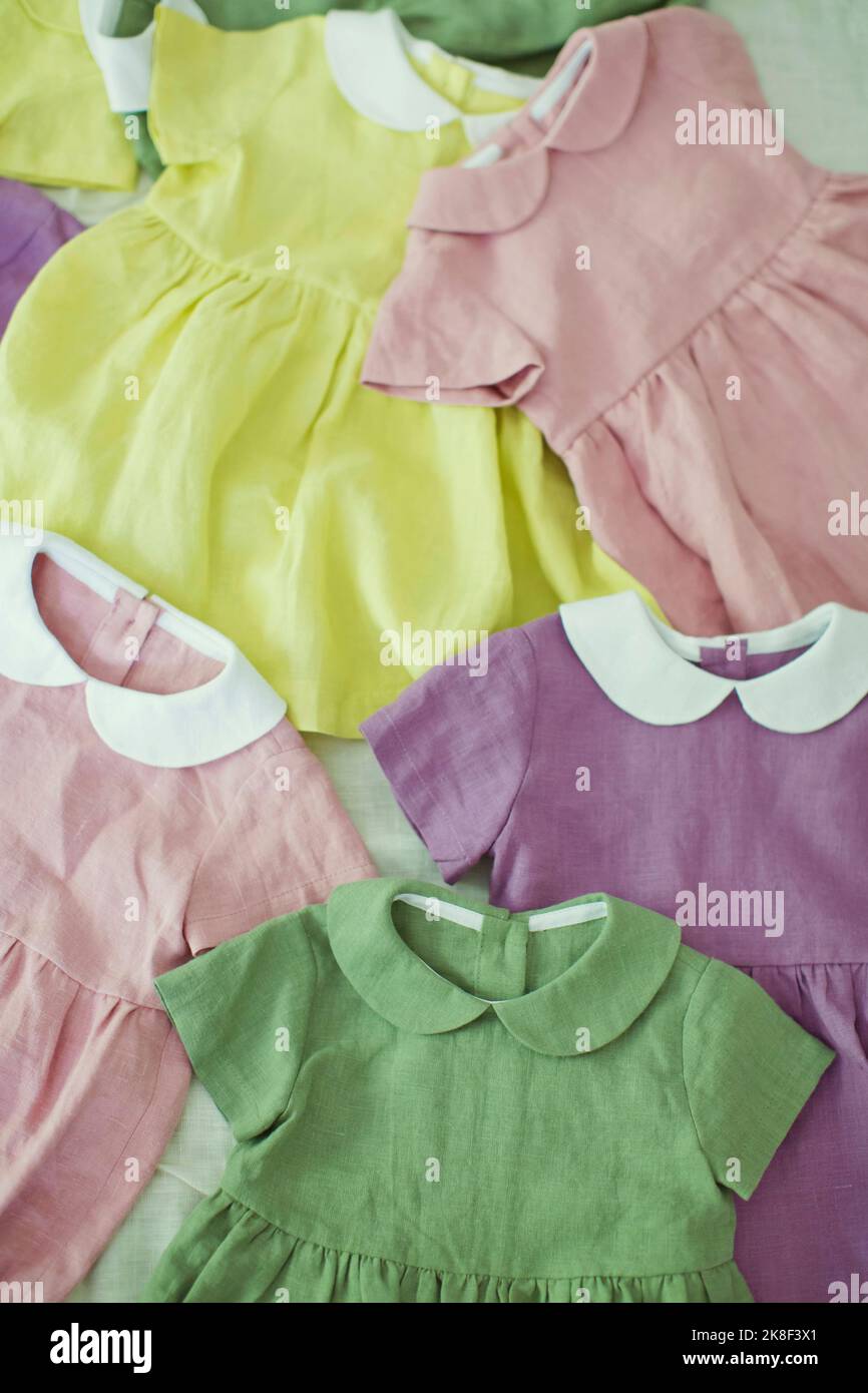 Colorful dresses arranged on floor Stock Photo - Alamy