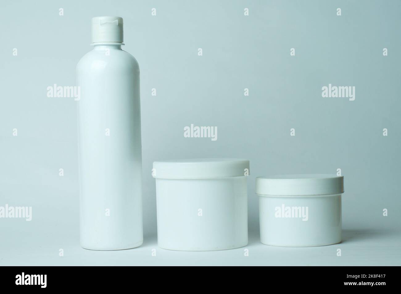 White cosmetic plain containers on isolated white background. Good for ...