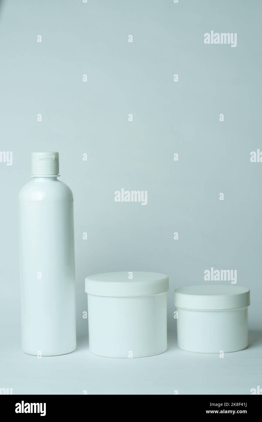 White cosmetic plain containers on isolated white background. Good for ...