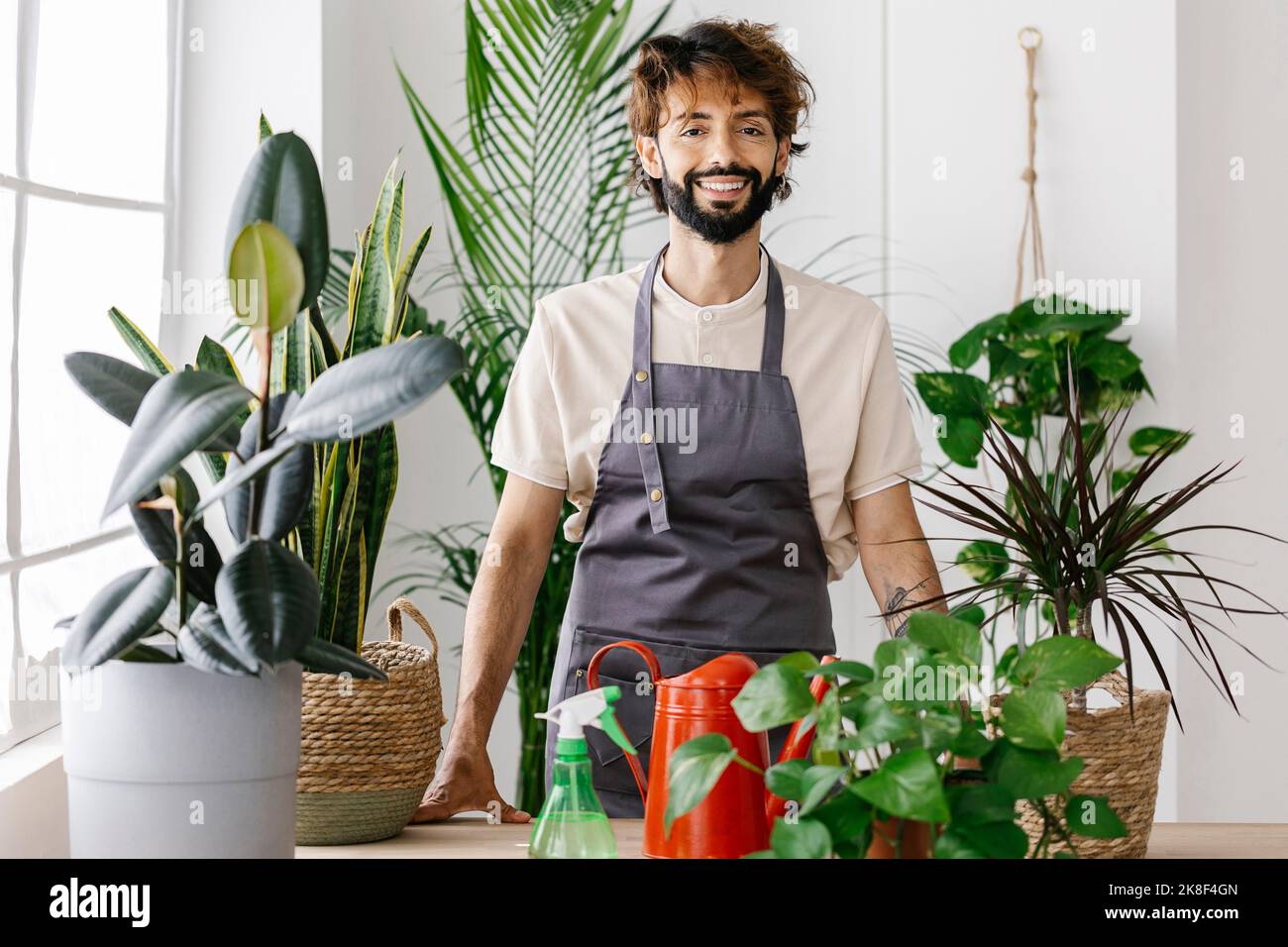 Happy owner of plant shop Stock Photo - Alamy