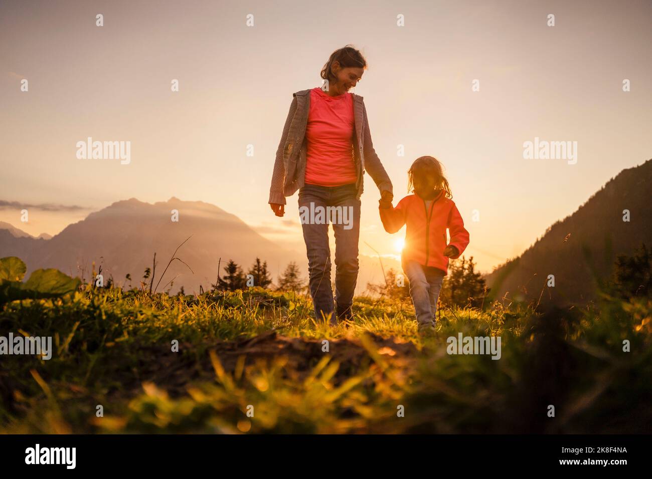 Mother and two daughters holding hands hi-res stock photography and ...