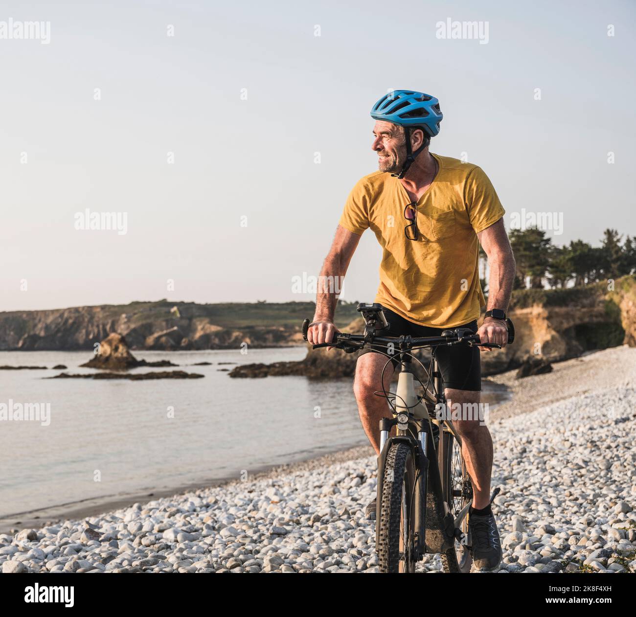 Riding bicycle man wearing hi-res stock photography and images - Alamy