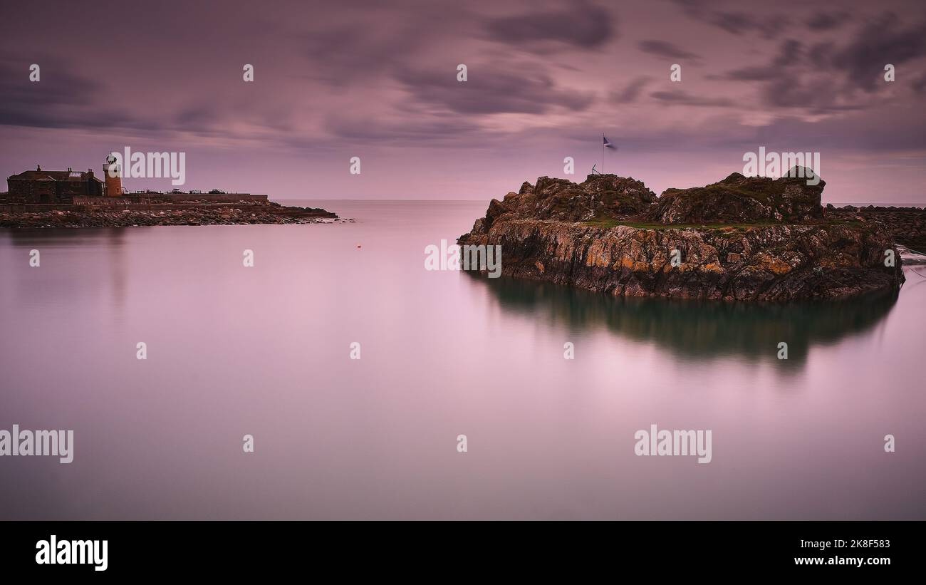 Port Patrick Harbour in Ayrshire, Scotland with lighthouse and milky ...