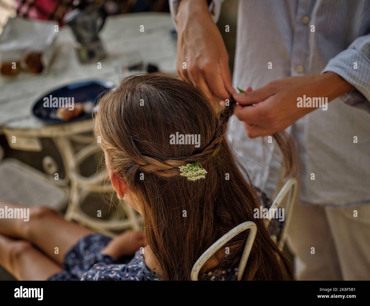 Mother braiding daughters hair hi-res stock photography and images - Alamy