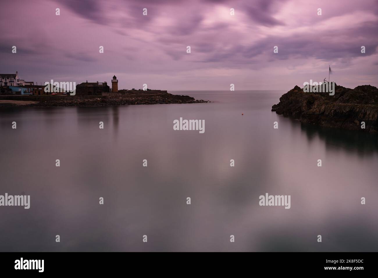 Port Patrick Harbour in Ayrshire, Scotland with lighthouse and milky ...