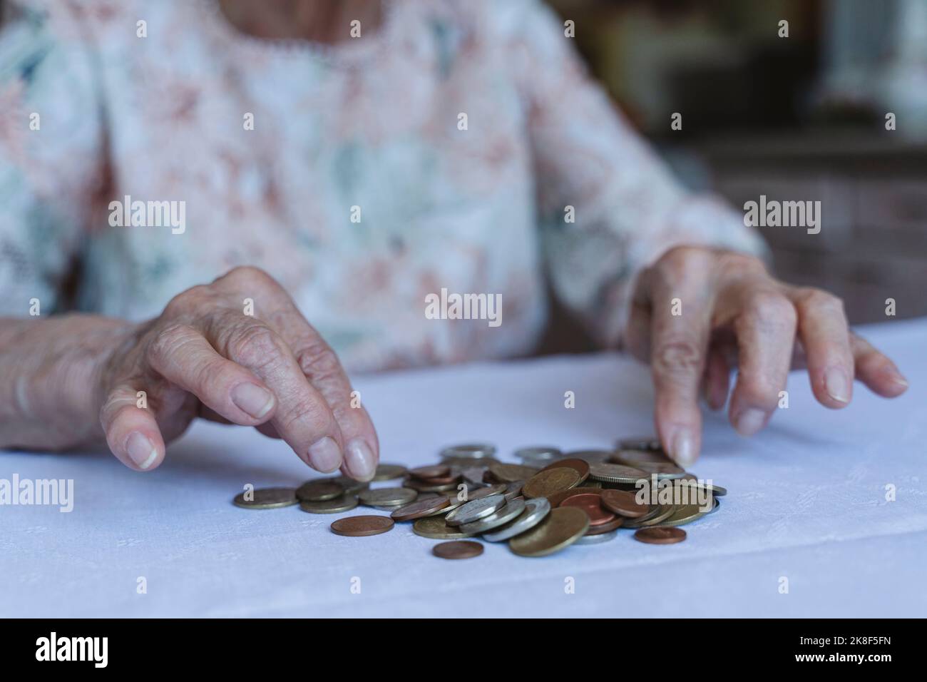 Table counting coins hi-res stock photography and images - Alamy