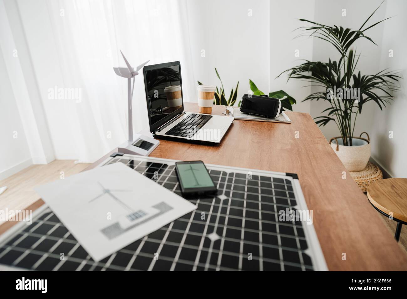 Portable solar panel and windturbine model on engineer's desk Stock ...