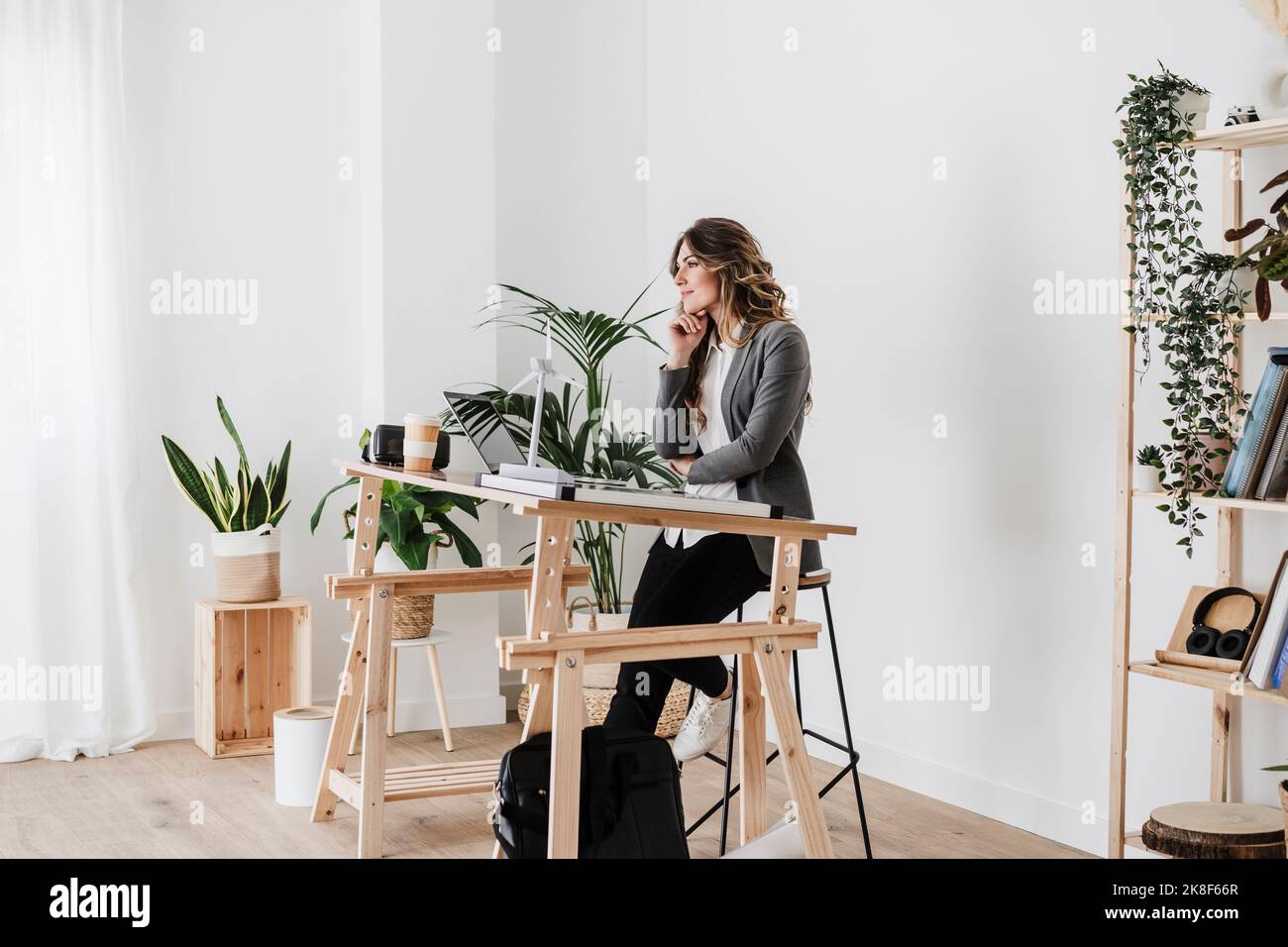 Young female engineer working in modern sustainable office Stock Photo ...
