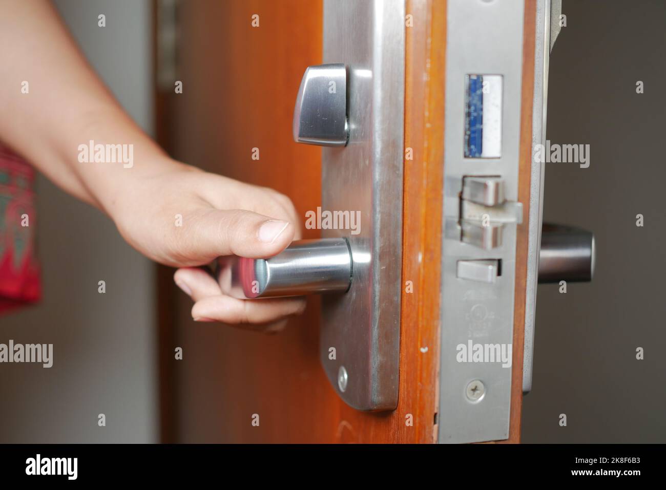 Man's Hand Opening door close up Stock Photo - Alamy