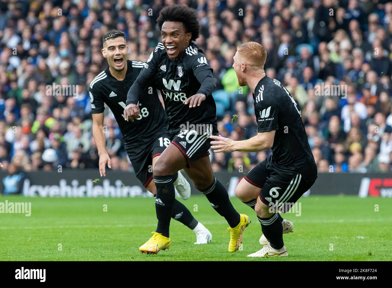 Willian #20 of Fulham celebrates his goal and makes the score 1-3 ...