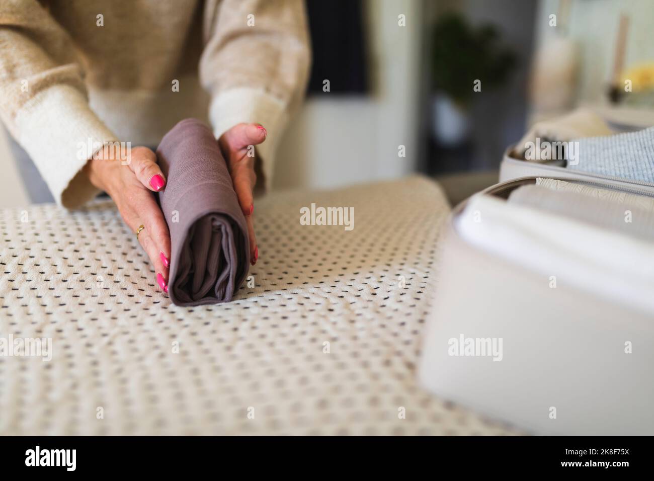 Rolling clothes packing hi-res stock photography and images - Alamy