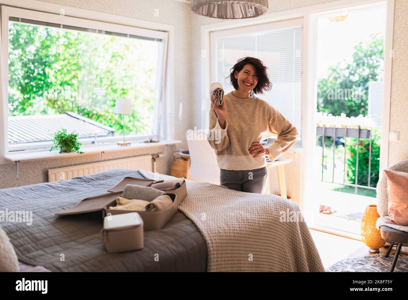 Hand holding clothes hi-res stock photography and images - Alamy