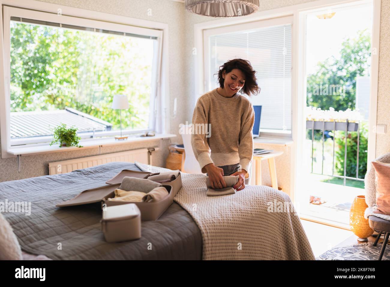 Rolling clothes packing hi-res stock photography and images - Alamy