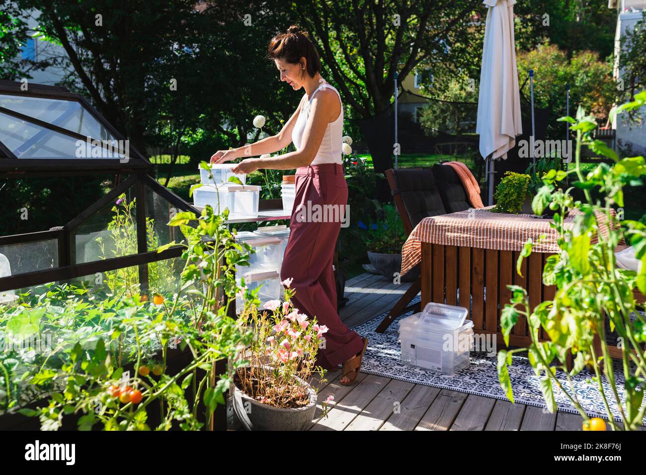 Garden terrace clean woman hi-res stock photography and images - Alamy