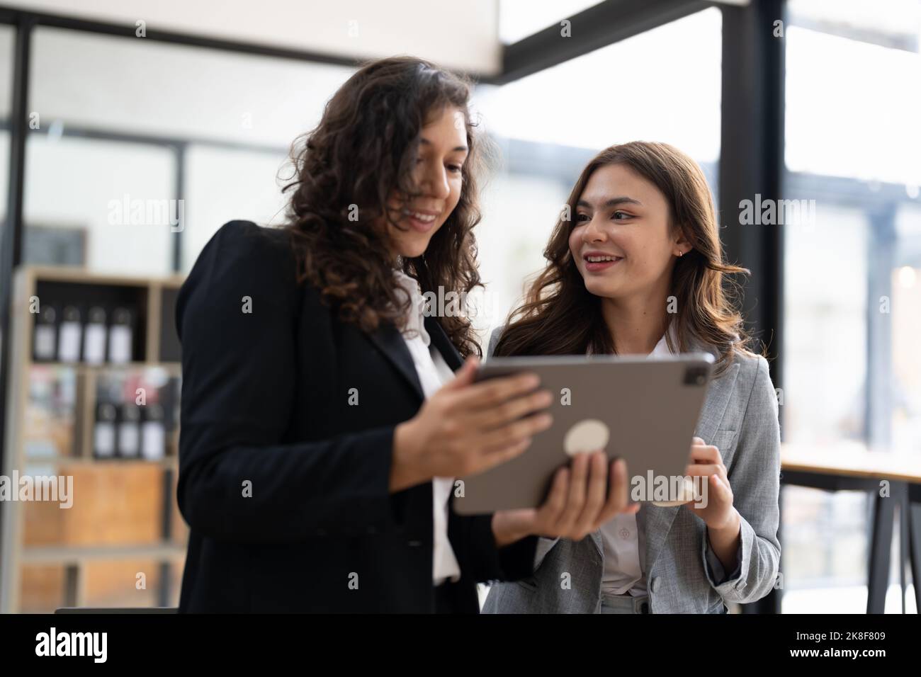 Diverse businesspeople cooperate work together discussing company financial statistics ...