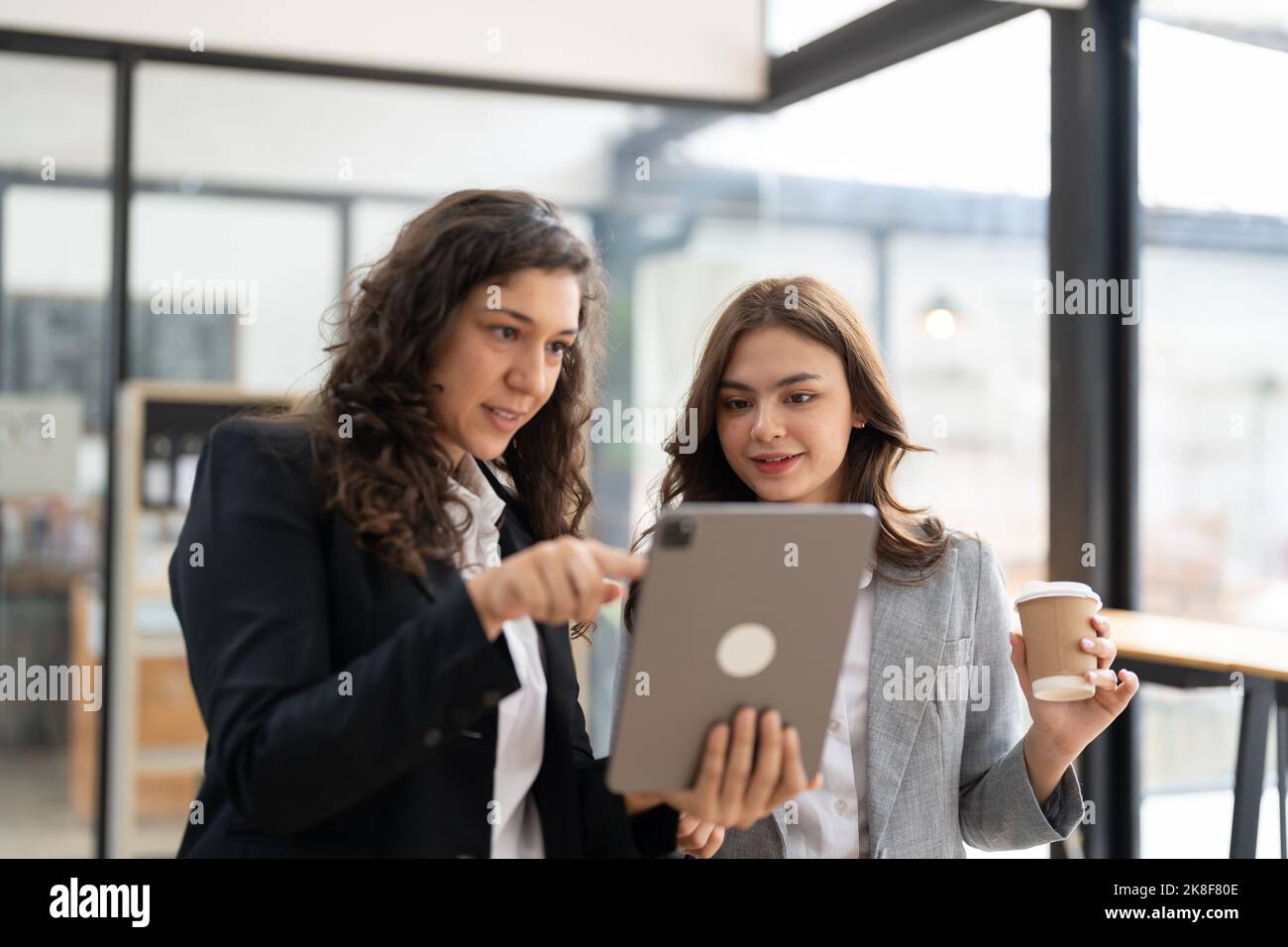 Diverse businesspeople cooperate work together discussing company financial statistics ...