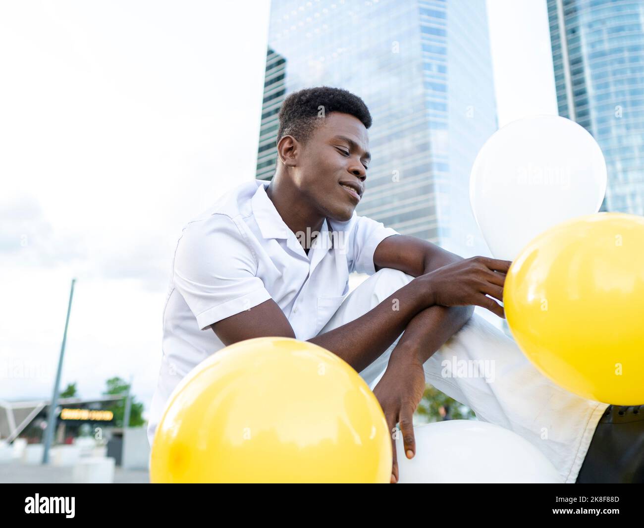 Man with balloons hi-res stock photography and images - Alamy