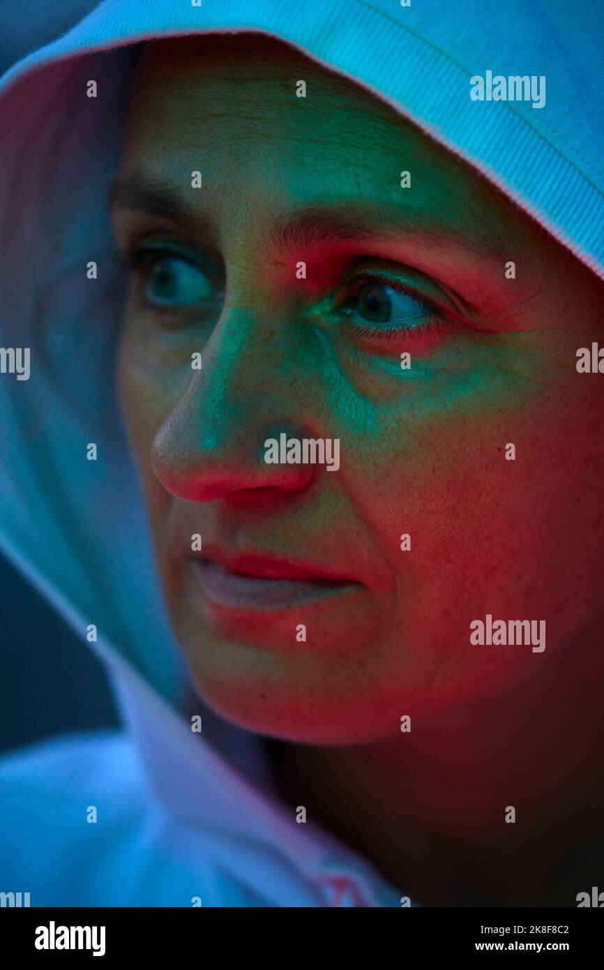 Contemplative woman with light reflection on face Stock Photo - Alamy