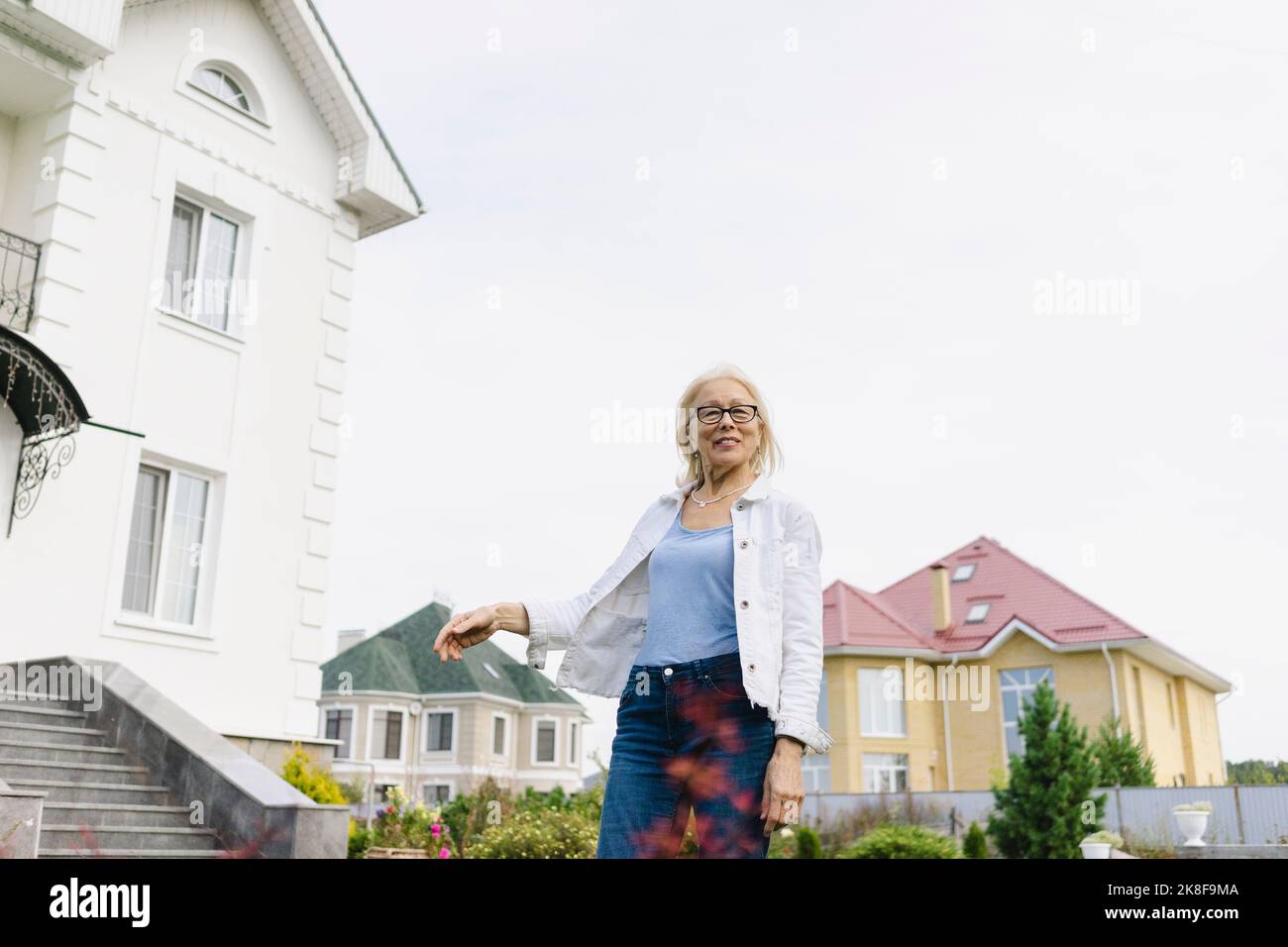 Senior woman standing outside hi-res stock photography and images - Alamy