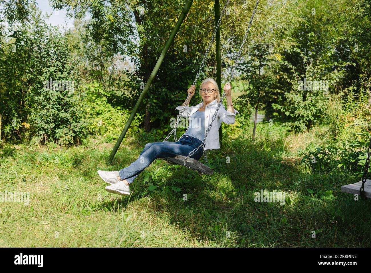 Senior woman in swing hi-res stock photography and images - Alamy