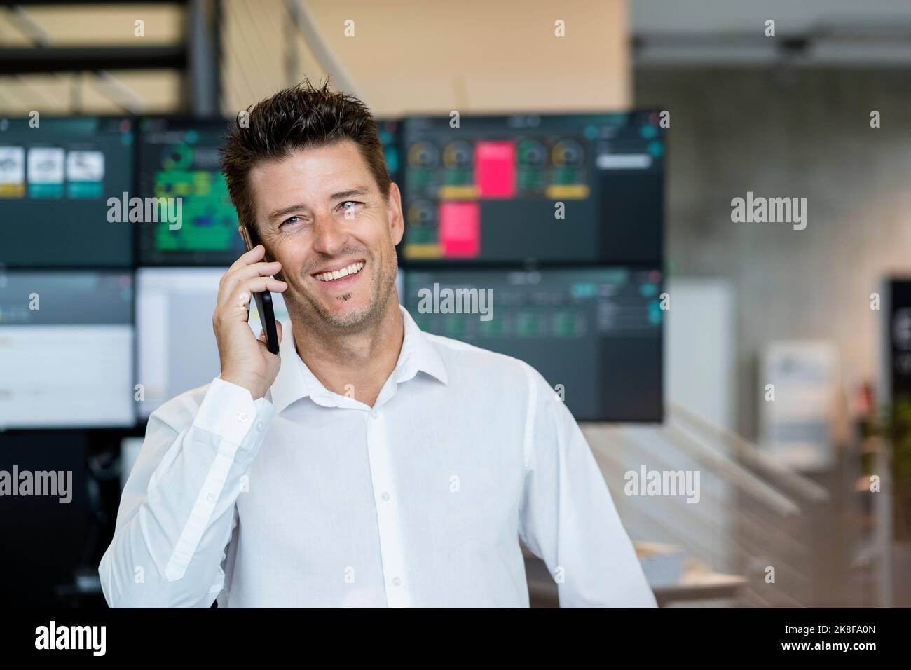 Mobile phone in front of computer hi-res stock photography and images ...