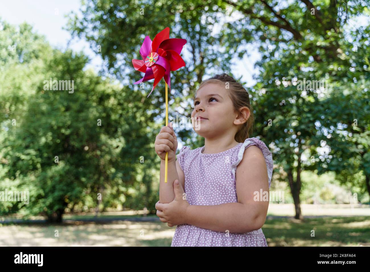 Girl pinwheel wind turbine hi-res stock photography and images - Alamy