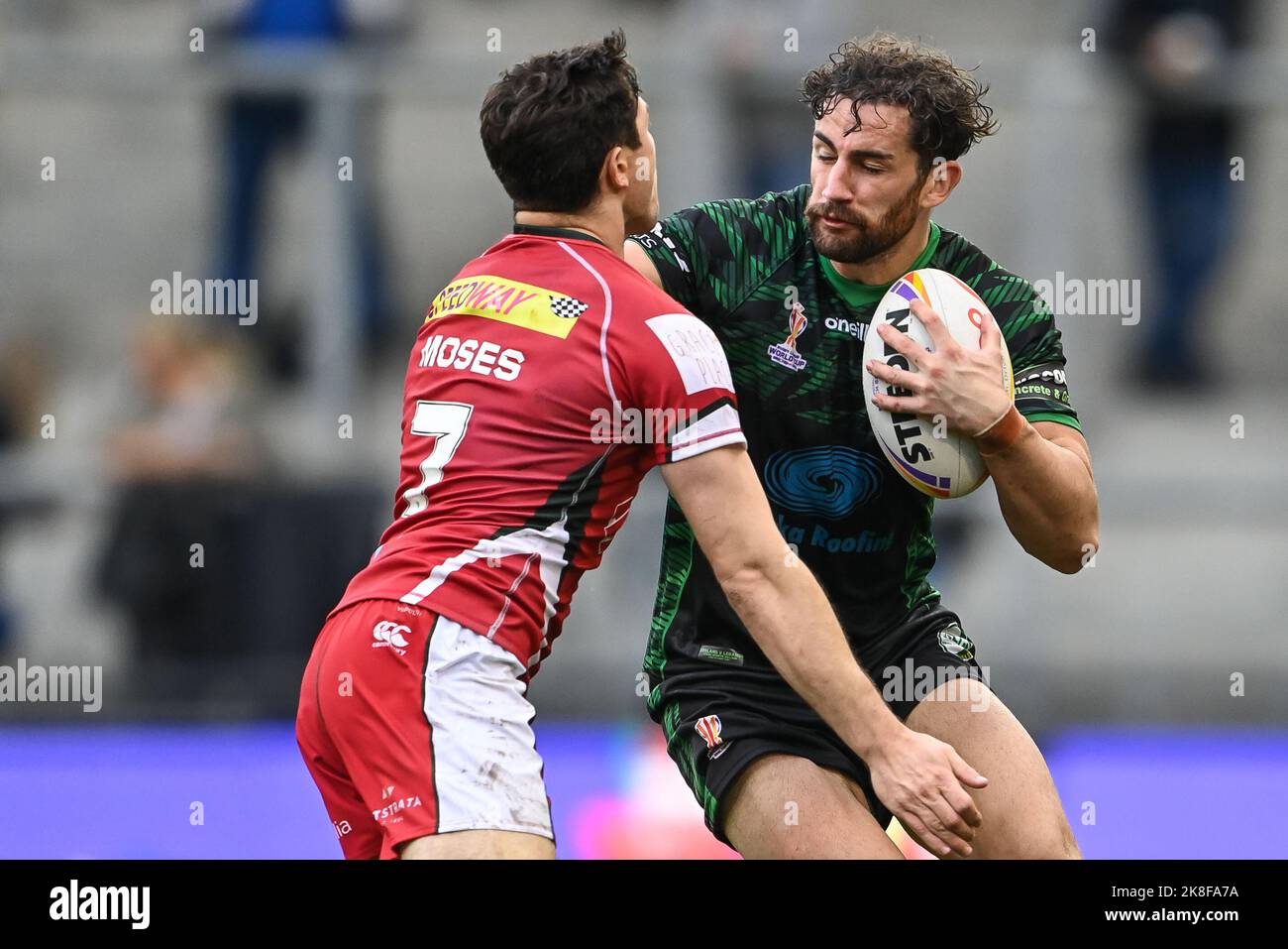Toby King of Ireland is tackled by Mitchell Moses of Lebanon during the ...