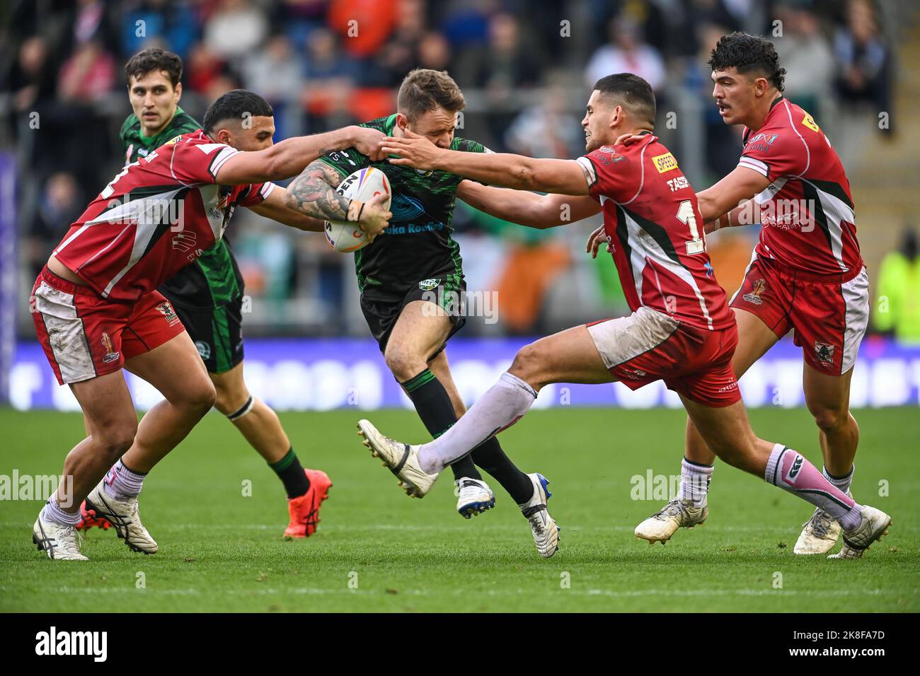Richie Myler of Ireland is tackled by Elie El-Zakhem and Charbel ...