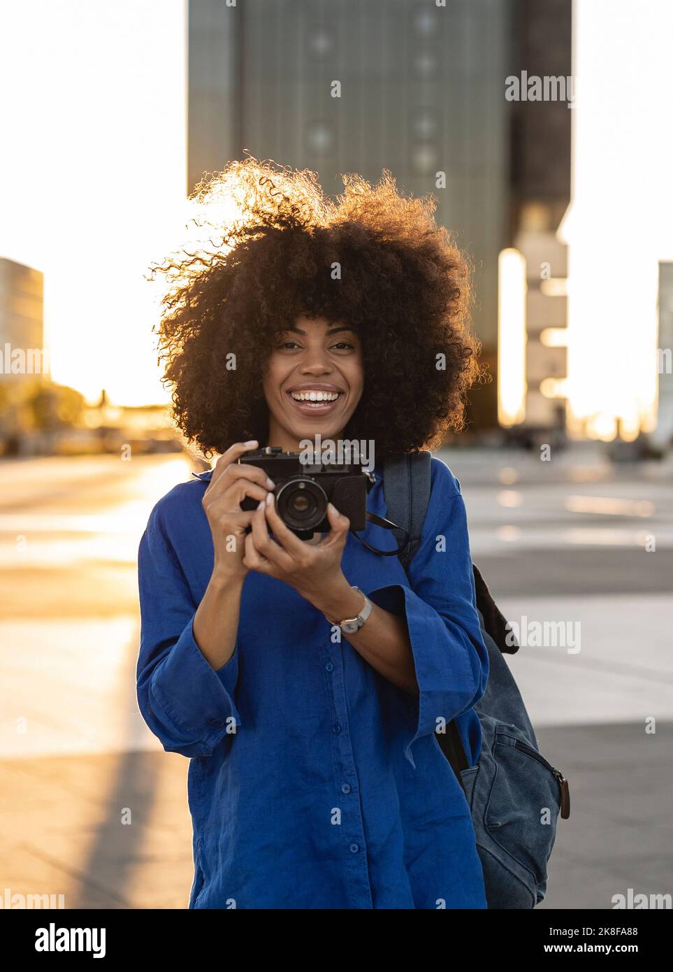 Cheerful afro american woman holding hi-res stock photography and ...