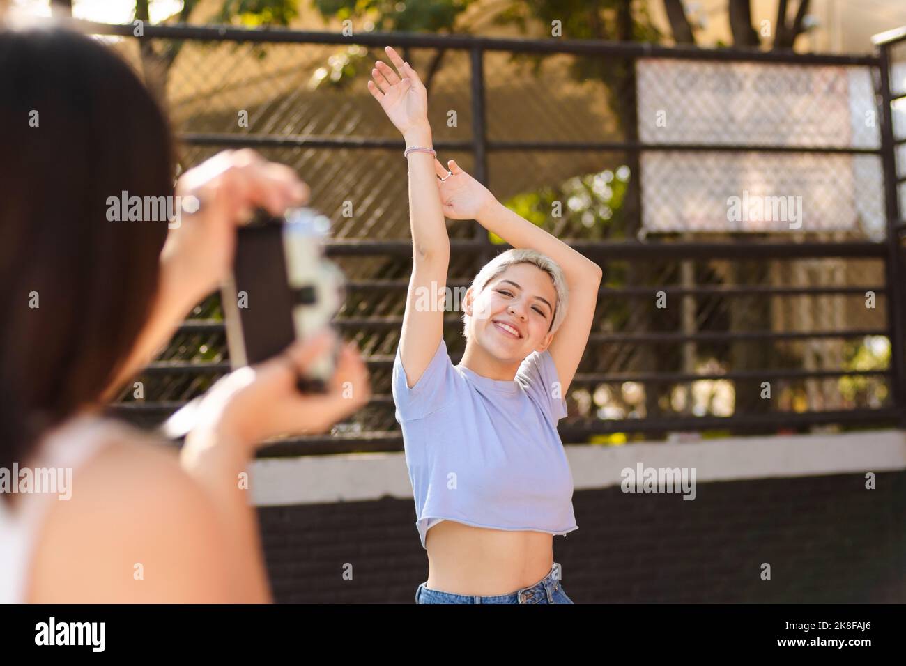 Two male friends photographing hi-res stock photography and images - Alamy