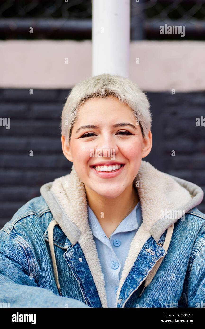 Cheerful non-binary person with gray hair Stock Photo - Alamy