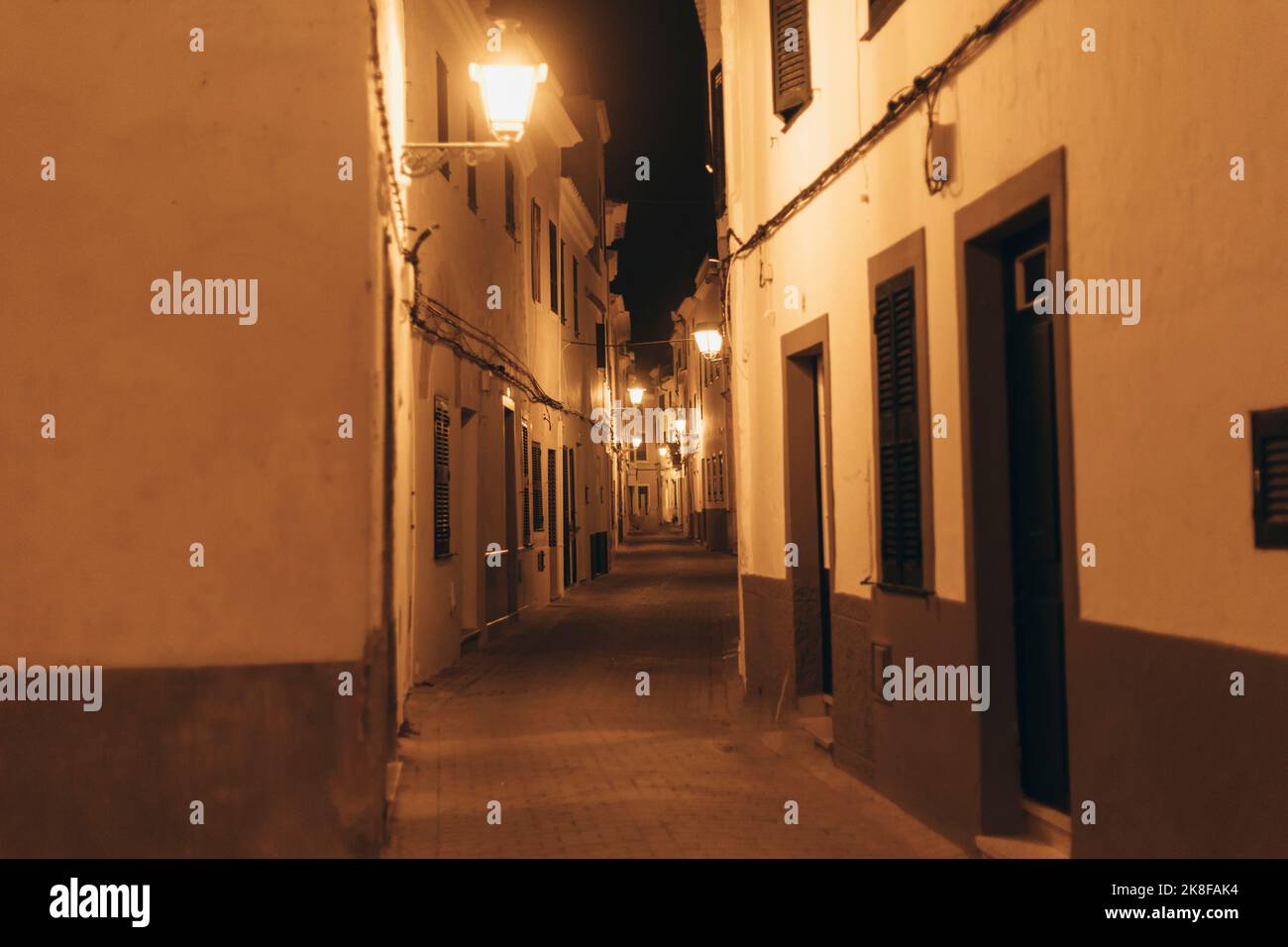 Empty illuminated alley night hi-res stock photography and images - Alamy