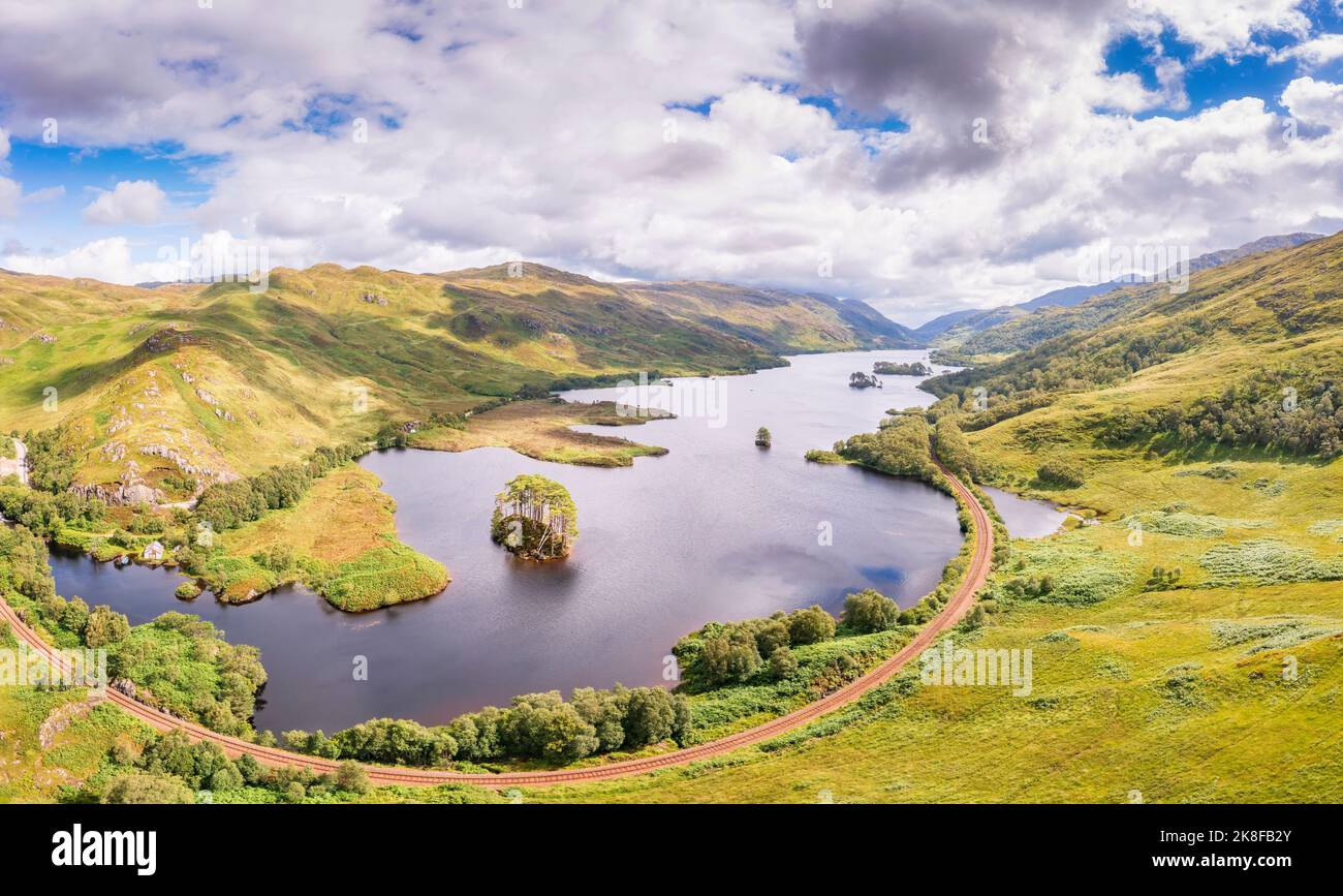Aerial view of West Highland railroad track by lake,Loch Eilt, Scotland ...