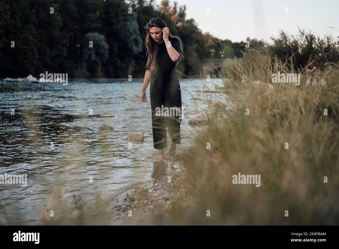 Young woman walking lake in hi-res stock photography and images - Alamy