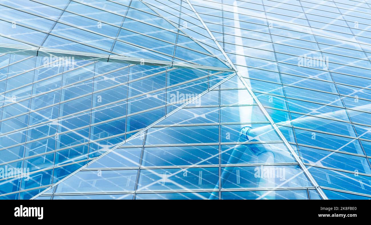 Sustainable glass building and wind power concept. Wind turbine and ...