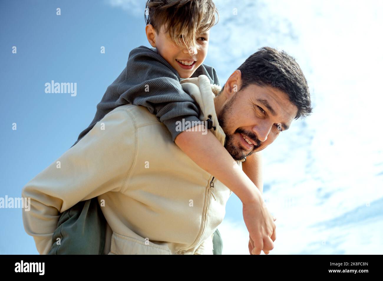 Father giving piggyback ride on hi-res stock photography and images - Alamy