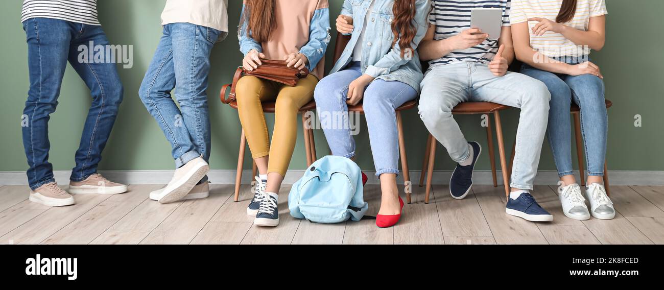 Group of people waiting in line indoors Stock Photo - Alamy