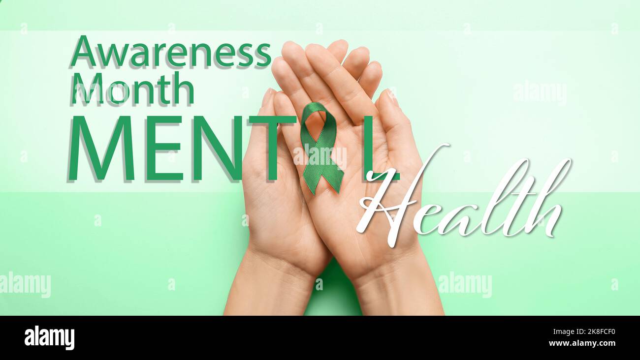 Male hands with green ribbon and text MENTAL HEALTH AWARENESS MONTH ...